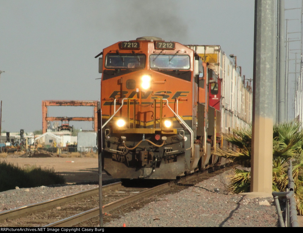 BNSF 7212 drops off cars.